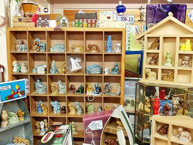 Miniature treasures await in this carefully curated display case. Each tiny figurine holds a story bigger than its stature.