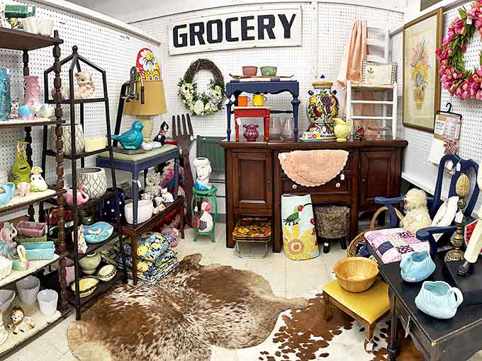 The "GROCERY" sign might be the only thing organized in this delightful chaos of collectibles. Nostalgia by the square foot!