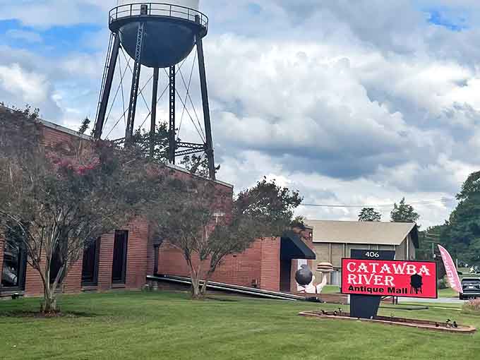 The iconic water tower stands sentinel over this treasure hunter's paradise, a brick building that houses generations of American history and quirky collectibles beneath Belmont's Carolina sky.