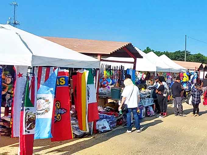 International flags flutter alongside racks of clothing, proving that at Mountain Top, you can travel the world without leaving Alabama.