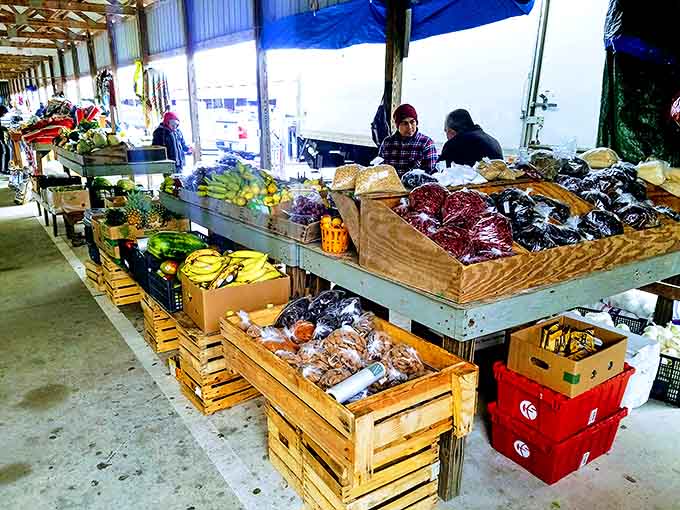 Fresh produce and homemade goodies line rustic wooden crates at The Barnyard Flea Market&mdash;farm-to-table shopping with character!