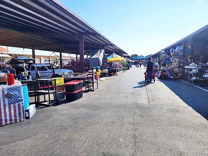 The covered walkways of Traders Village stretch toward the horizon like a bargain hunter's yellow brick road. Shopping paradise awaits under those metal roofs!