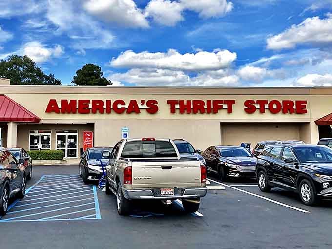 The bold red letters against beige stucco promise adventure within. Like a treasure map where X marks the bargain.