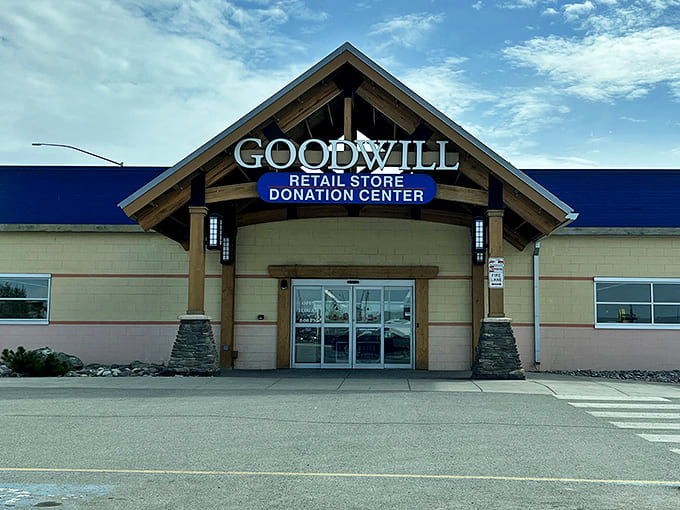 The Alaskan lodge-inspired exterior of Goodwill beckons like a siren song to bargain hunters. Those wooden beams aren't just for show&mdash;they're holding up dreams of affordable treasures.