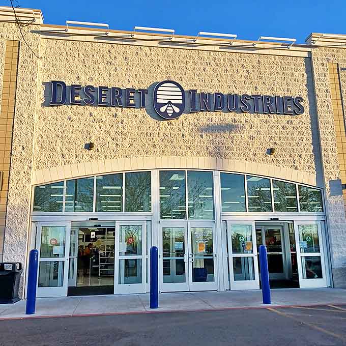 The beige facade of Deseret Industries in Glendale beckons like a siren song to bargain hunters. Treasure awaits inside those blue-framed doors!