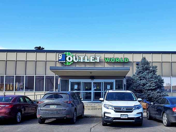 The unassuming facade of Outlet World beckons bargain hunters like a siren call to the thrifty. Behind these doors, shopping becomes sport.