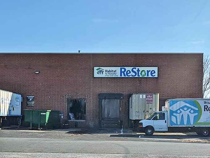 The unassuming brick exterior of Prices Corner ReStore hides a treasure trove within. Like finding the entrance to Narnia, but with more sofas and fewer talking lions.
