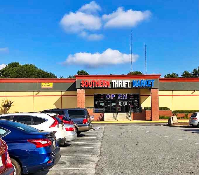 The storefront beckons under clear Georgia skies, its red-white-blue sign promising treasure hunting adventures that mall shopping simply can't deliver.