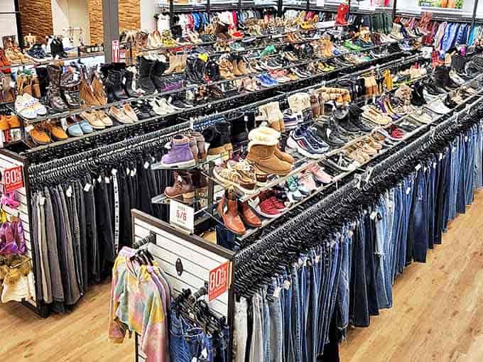 A shopper's dream&mdash;rows of quality footwear above meticulously arranged jeans, proving thrifting doesn't mean sacrificing organization or selection.