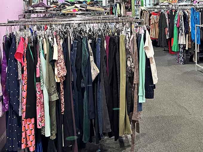 Racks upon racks of clothing create a textile rainbow, each garment holding stories and possibilities for its next owner.