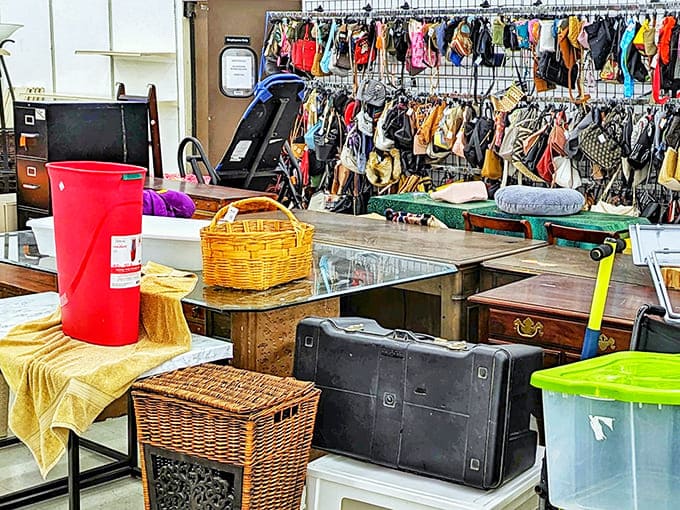 A treasure hunter's paradise awaits! Tables piled with vintage handbags, wicker baskets, and mysterious suitcases create the ultimate "what's inside?" adventure.