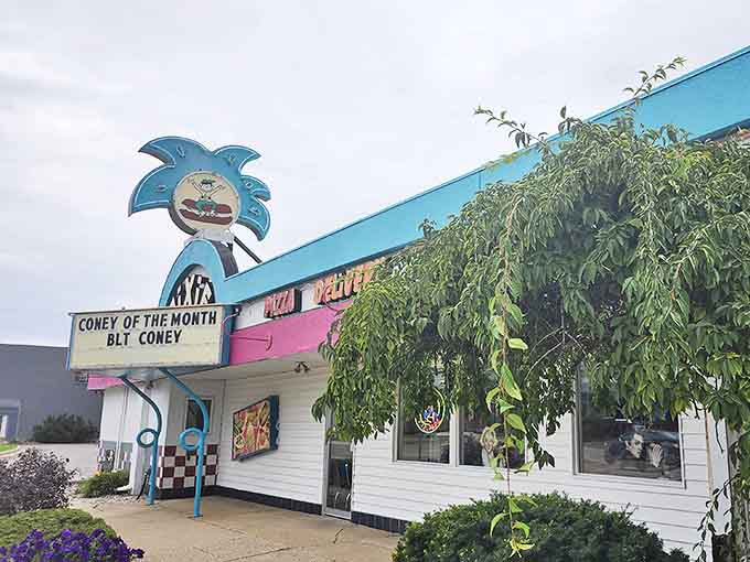 Even on cloudy days, the Pixie's vibrant exterior and whimsical signage announcing the "Coney of the Month" brightens the Michigan landscape.