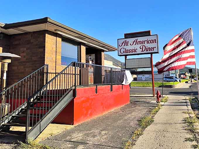 The iconic All American Classic Diner sign beckons hungry travelers like a lighthouse for the famished. Cedar City's culinary landmark stands ready to serve.