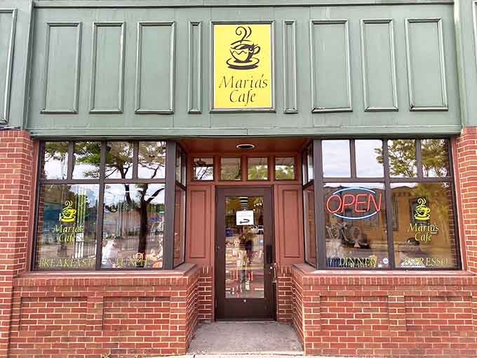 The welcoming entrance to Maria's Cafe, with its simple signage and neon "OPEN" sign beckoning hungry Minneapolis diners inside.