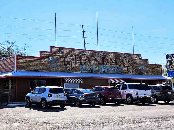 The brick facade and bold signage of Grandma's K & I Diner stands like a beacon of breakfast hope against Albuquerque's brilliant blue sky.