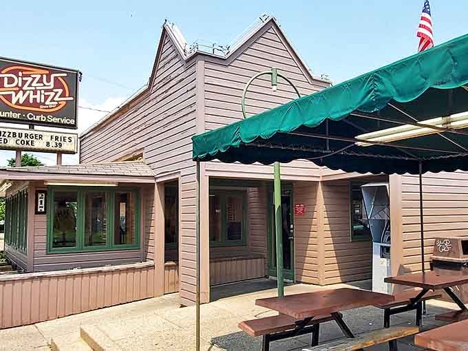 The distinctive peaked roof and green awning create that unmistakable silhouette that says, "Pull over, hungry traveler&mdash;culinary nostalgia awaits."