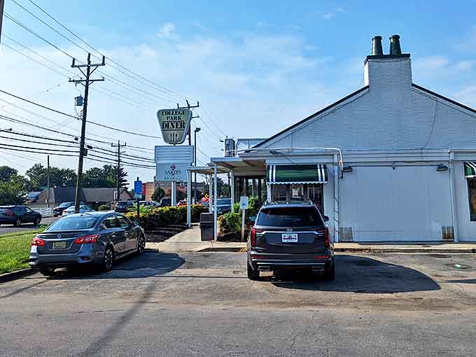 The classic roadside silhouette of College Park Diner stands like a beacon for hungry travelers. That vintage sign promises comfort food salvation ahead.