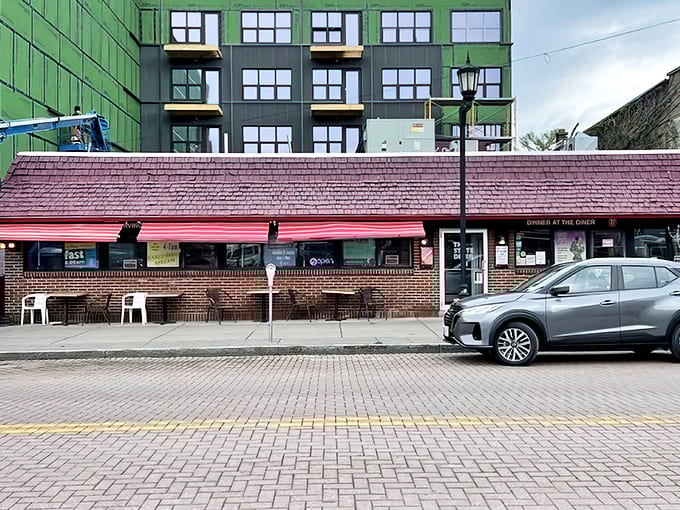 The classic brick exterior of The State Diner stands proudly on West State Street, a cozy contrast to Ithaca's modern buildings.
