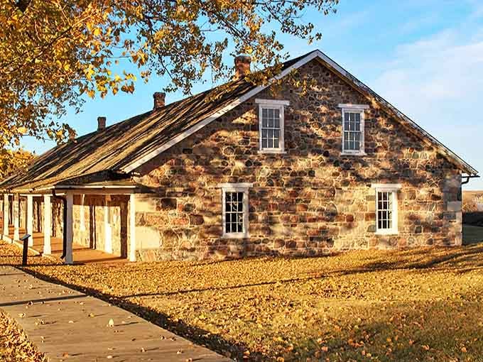 History stands strong in Sisseton's stone buildings, where autumn leaves create a golden carpet beneath structures that have witnessed generations of South Dakota life.