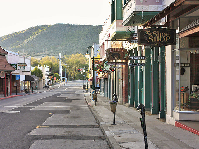 Yreka's charming Miner Street at dusk, where locally-owned shops nestle against rolling hills&mdash;a perfect snapshot of small-town tranquility.