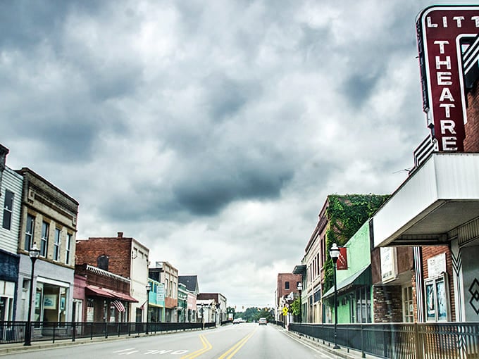 Main Street whispers stories of simpler times, where brick facades and blue skies create the perfect backdrop for unhurried living.