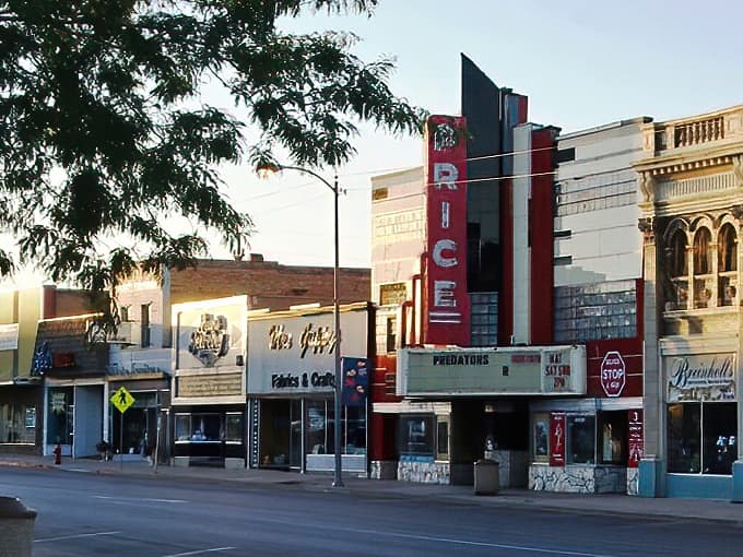 The historic Price Theatre's iconic red vertical sign stands as a beacon of affordable entertainment in this charming eastern Utah town.