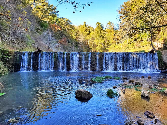 Nature's own infinity pool! This cascading waterfall creates a mesmerizing blue-green oasis that looks Photoshopped but is 100% Oklahoma magic.