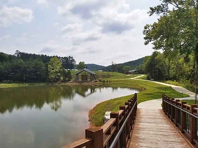 Serenity now! A wooden bridge leads to rustic cabins reflected in waters so still they could double as nature's mirror.