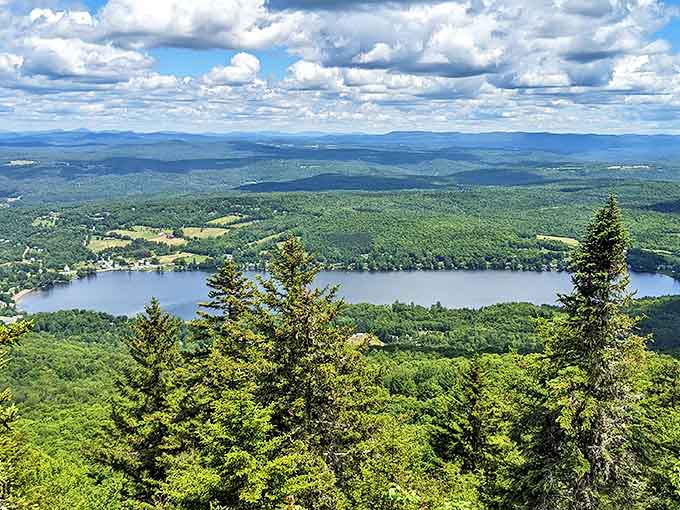 The view from Elmore Mountain's fire tower reveals Vermont's patchwork quilt of forests, farms, and the glistening jewel of Lake Elmore below.