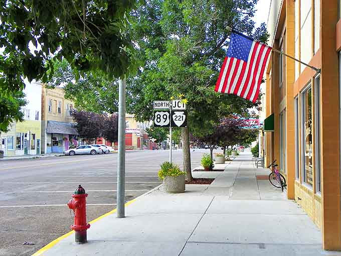 Main Street Choteau welcomes you with classic Americana charm &ndash; highway signs, fire hydrants, and flags that practically whisper "slow down and stay awhile."