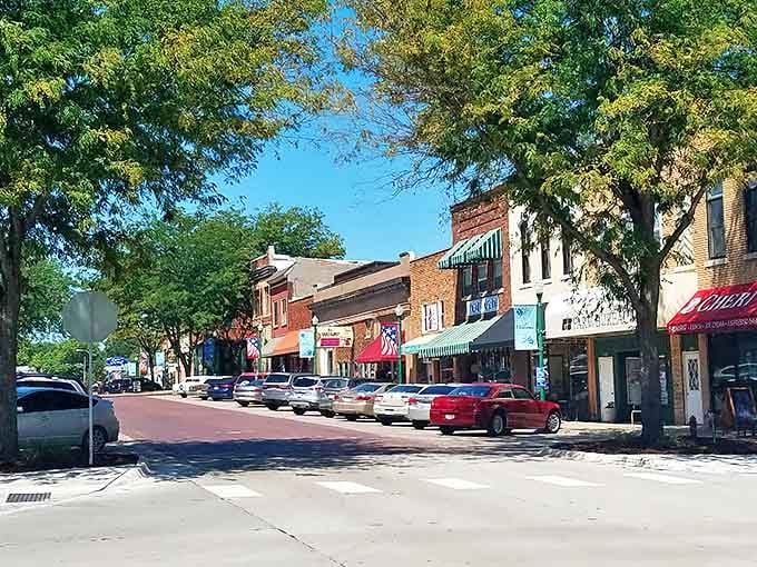Silver Street stretches before you like a Norman Rockwell painting come to life, where brick storefronts and leafy trees create the perfect small-town tableau.
