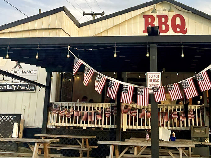 The American flags fluttering outside aren't just decoration – they're a promise of patriotic devotion to proper barbecue traditions.