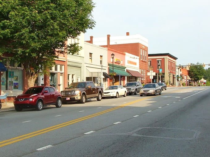 Downtown Eatonton's historic storefronts transport you to a simpler time, where brick facades and green awnings create the perfect small-town tableau.