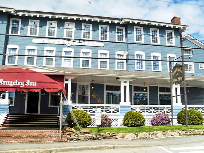The Rangeley Inn stands as the grande dame of Main Street, her blue clapboard and welcoming porch promising stories from another era.