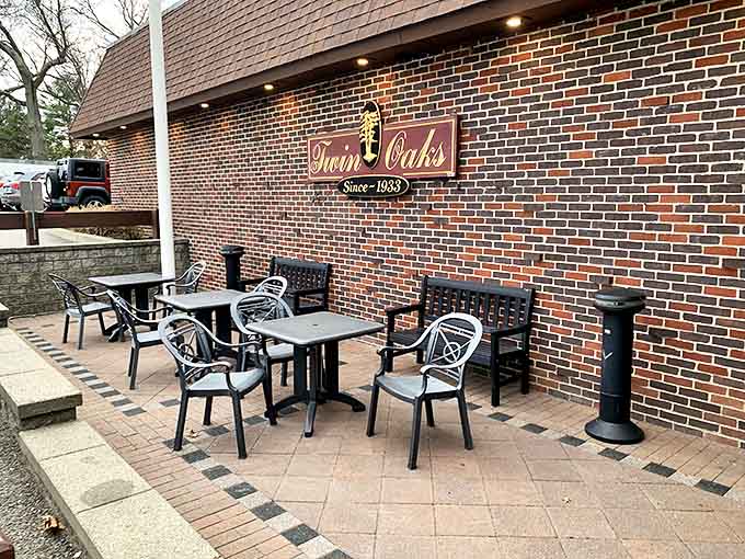 The classic brick exterior of Twin Oaks stands proudly under Rhode Island skies, an American flag waving as if to say "come hungry, leave happy."