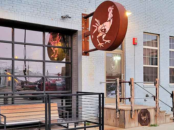 The iconic rooster sign beckons hungry travelers like a North Dakota lighthouse, promising delicious refuge from the prairie winds.