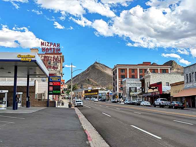 The iconic Mizpah Hotel sign stands sentinel over Tonopah's main drag, promising vintage luxury in a town where the gas prices are the only modern thing in sight.