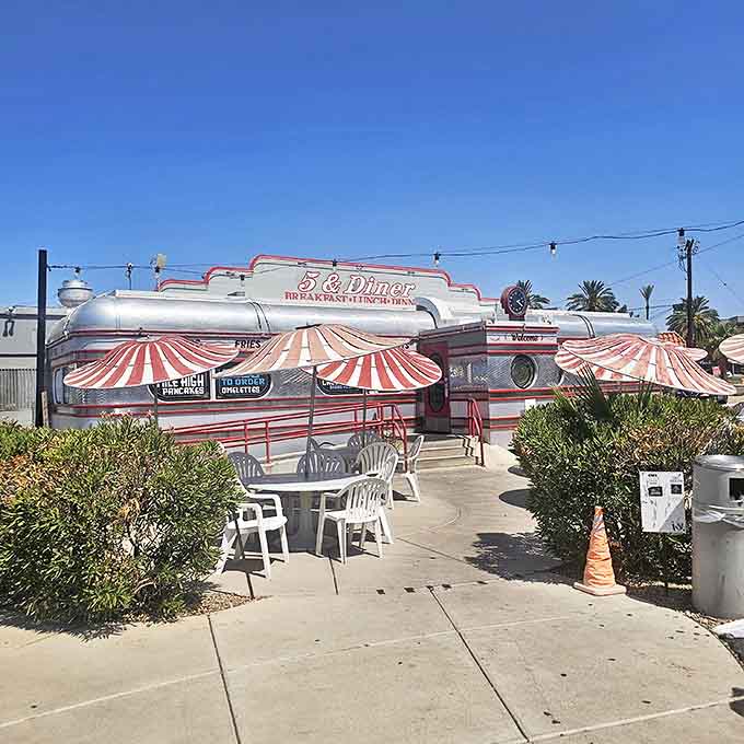 A closer view of 5 & Diner's chrome facade and outdoor seating area, where you can enjoy breakfast classics in Phoenix's perfect weather.