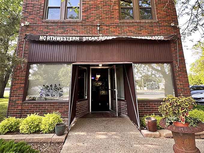 This modest entrance has welcomed generations of steak enthusiasts, proving that the best culinary treasures often hide in plain sight.