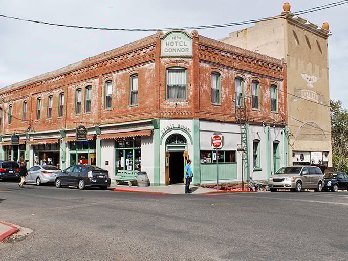 The historic Hotel Connor stands proudly at Jerome's crossroads, a brick sentinel that's witnessed more Arizona drama than a cactus in a thunderstorm.