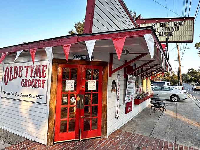 Those festive red pennants aren't just decoration&mdash;they're celebratory flags signaling that po'boy paradise awaits inside. The red doors practically beckon you forward.