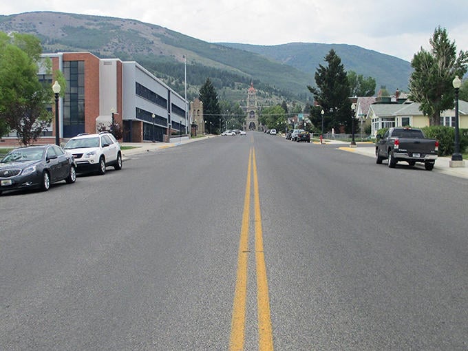 Main Street stretches toward mountain vistas, offering that perfect small-town feel where rush hour means three cars at the stoplight.