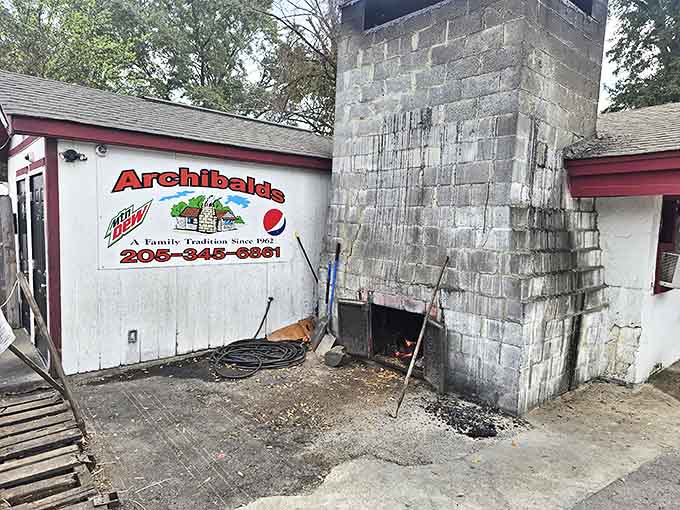 The smoke-stained chimney tells you everything you need to know: serious barbecue happens here. No fancy frills, just decades of delicious dedication.