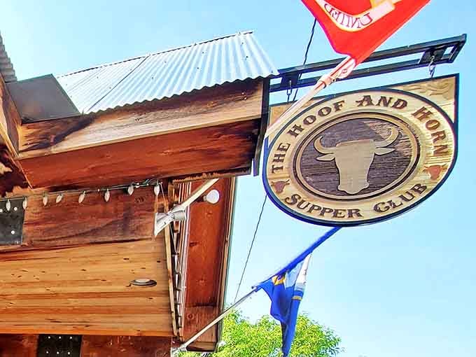 The iconic Hoof & Horn sign swings like a beacon of hope for hungry travelers, promising hearty meals and heartland hospitality beneath that rustic wooden awning.
