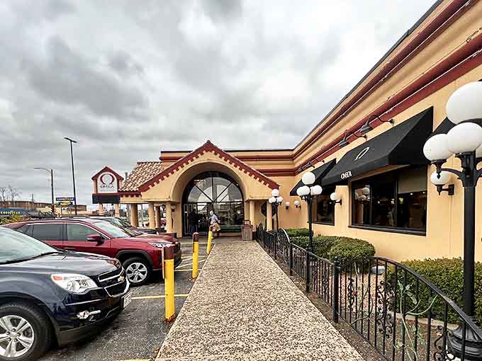 A stone pathway leads to Omega's entrance, where the blend of casual diner charm and Greek influence begins before you even step inside.