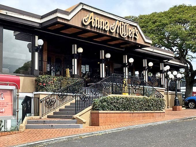 The iconic wooden fa&ccedil;ade of Anna Miller's welcomes diners with its vintage charm and American flag, a slice of nostalgic Americana in Aiea.