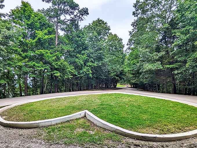 The perfect cul-de-sac of serenity. This peaceful green space surrounded by towering trees offers a moment to breathe before your adventure begins.