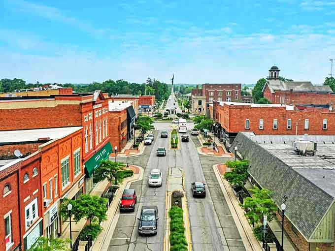 From this bird's-eye view, Angola's main street stretches into the distance, lined with the kind of brick buildings that whisper stories of America's heartland.