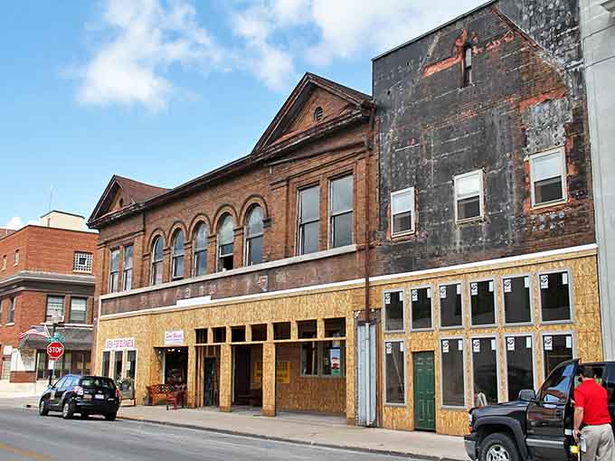 This architectural time capsule awaits restoration, its arched windows and weathered facade whispering stories of Danville's vibrant past while promising future renewal.