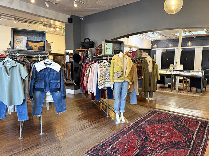 Vintage rugs meet modern merchandising in this thoughtfully arranged showroom. The clothing isn't just displayed&mdash;it's curated like exhibits in a wearable art gallery.